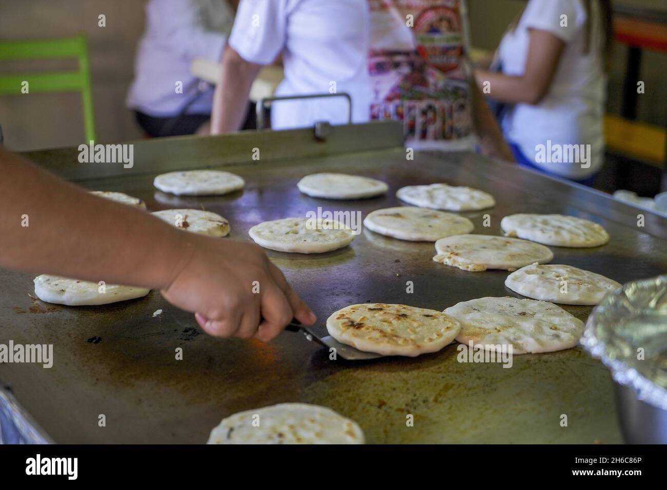 Olocuilta, El Salvador. 14th Nov, 2021. A worker prepares pupusas for ...