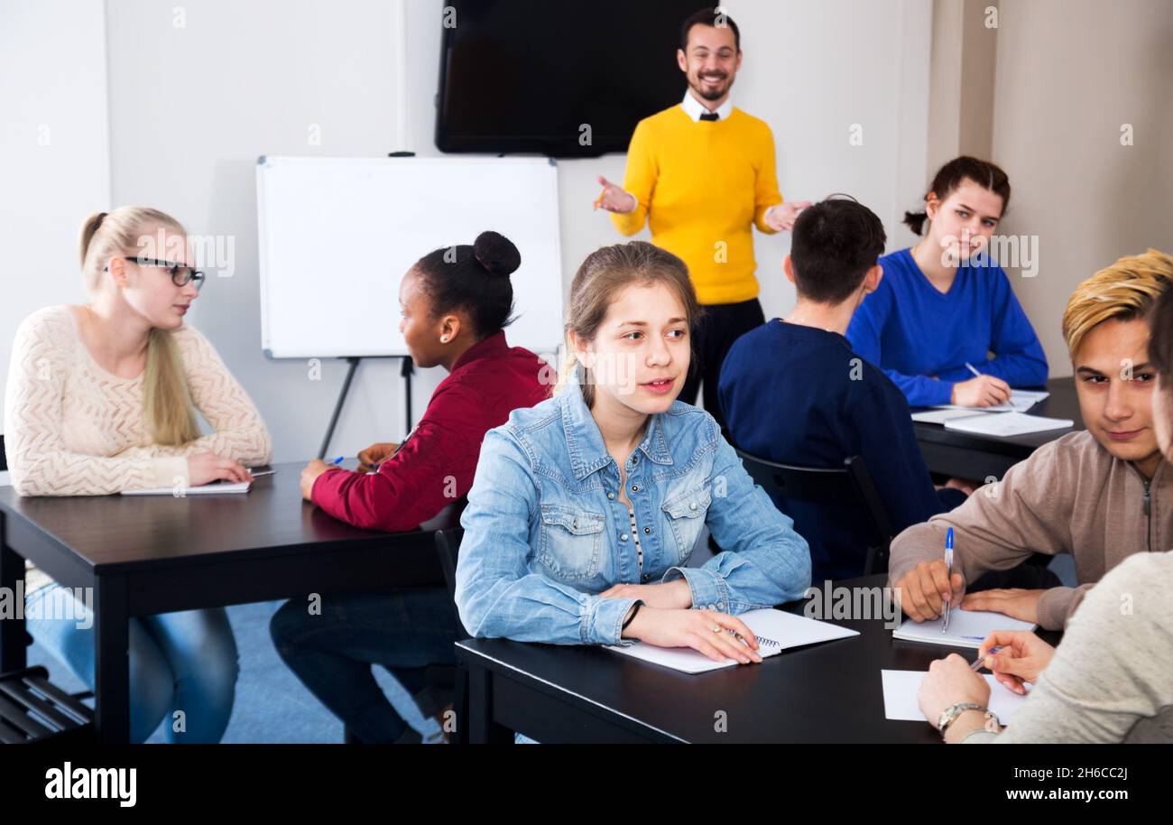 Classmates working in groups Stock Photo - Alamy