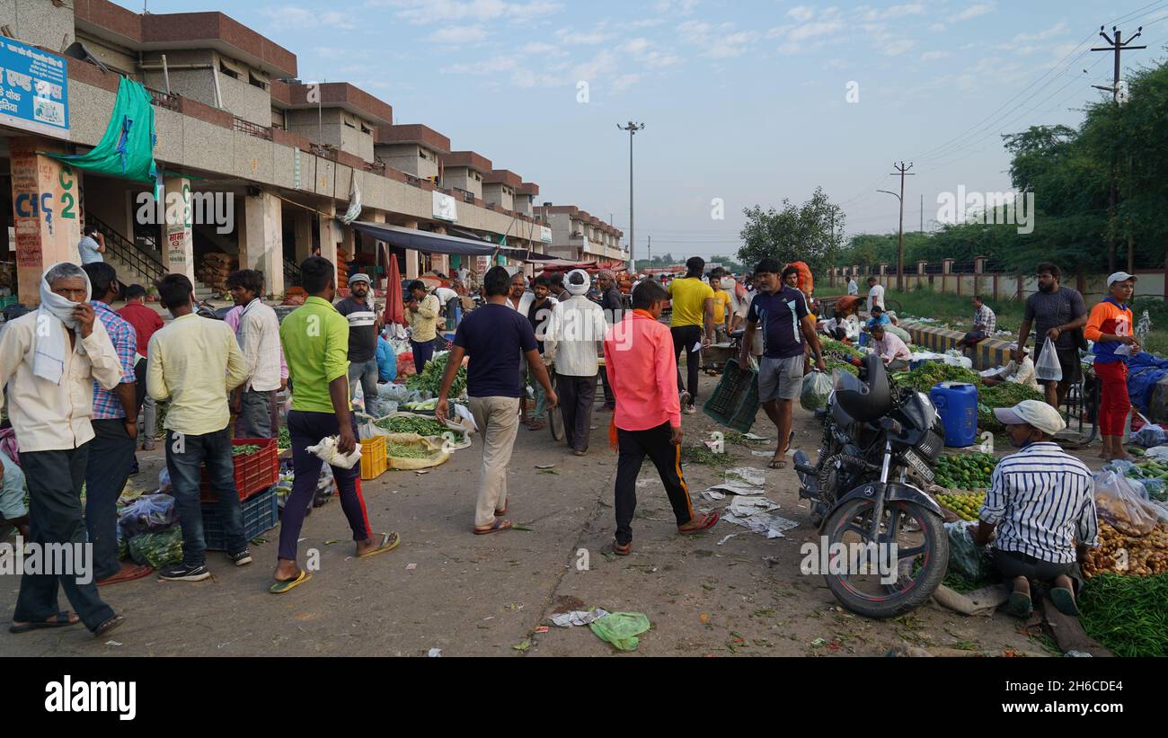 A friendly indian vendor weighing vegetables for a customer hi-res stock photography and images ...