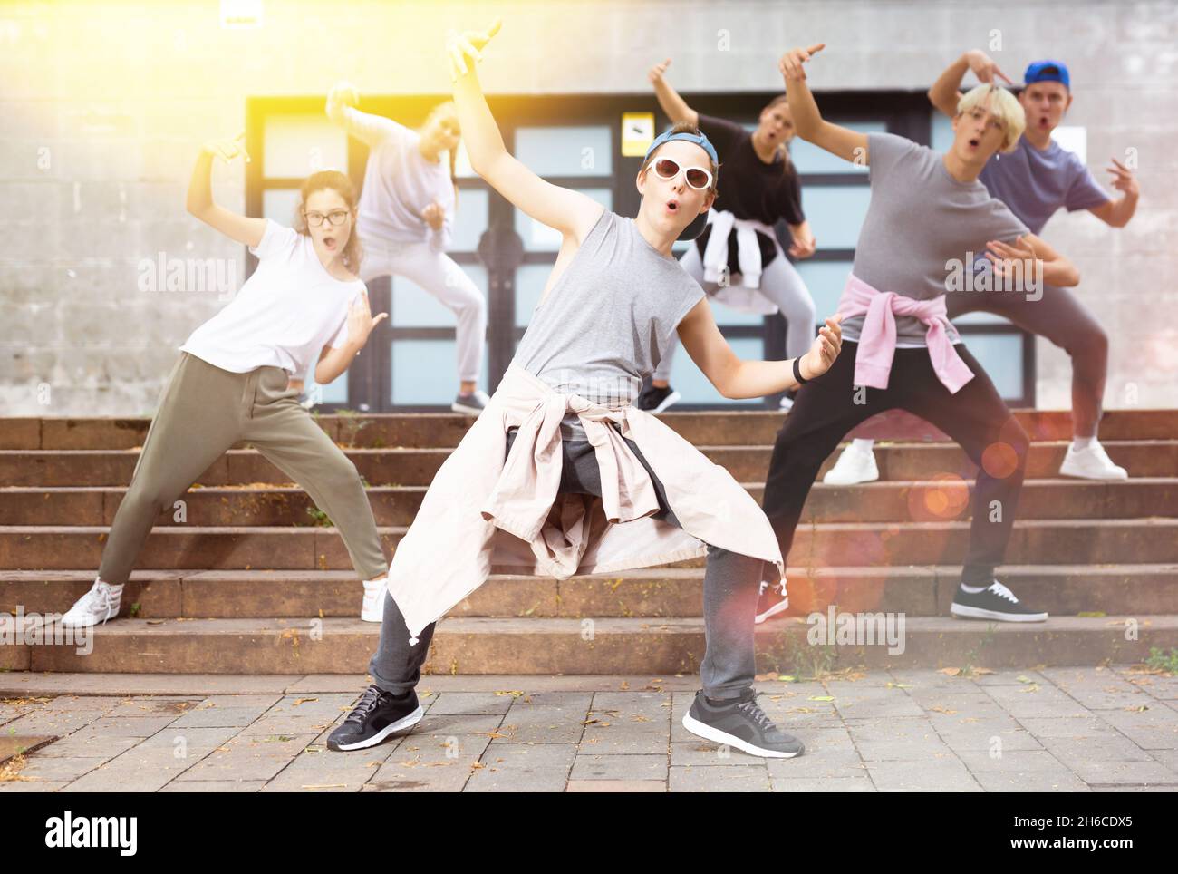 Teen boy dancing modern street dance with teenagers Stock Photo - Alamy