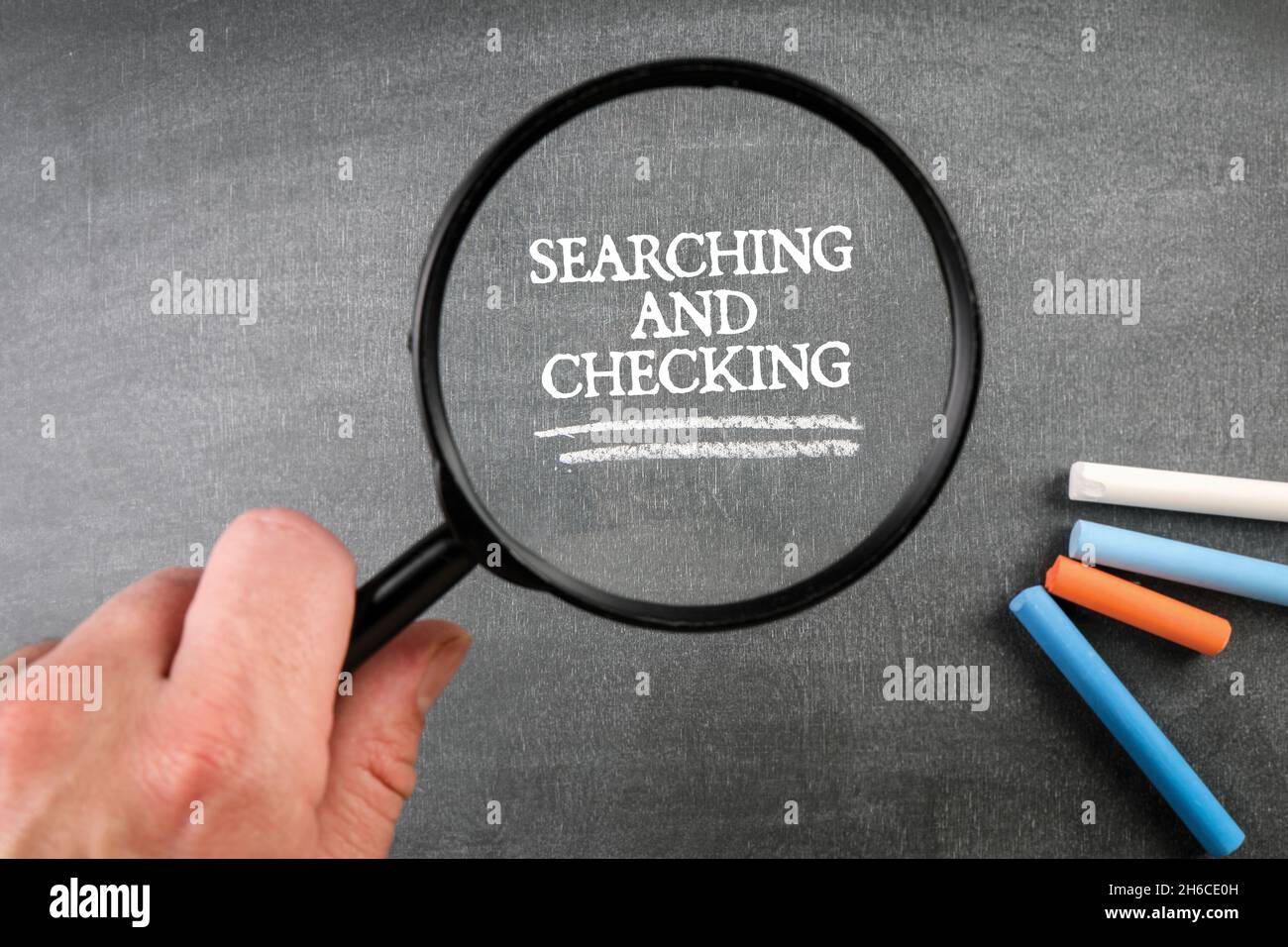 Searching and Checking. Magnifying glass in a man's hand Stock Photo ...