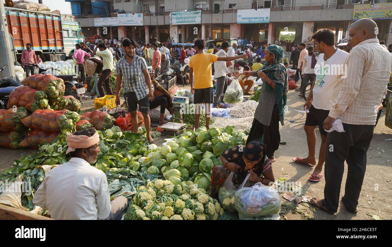 A friendly indian vendor weighing vegetables for a customer hi-res stock photography and images ...