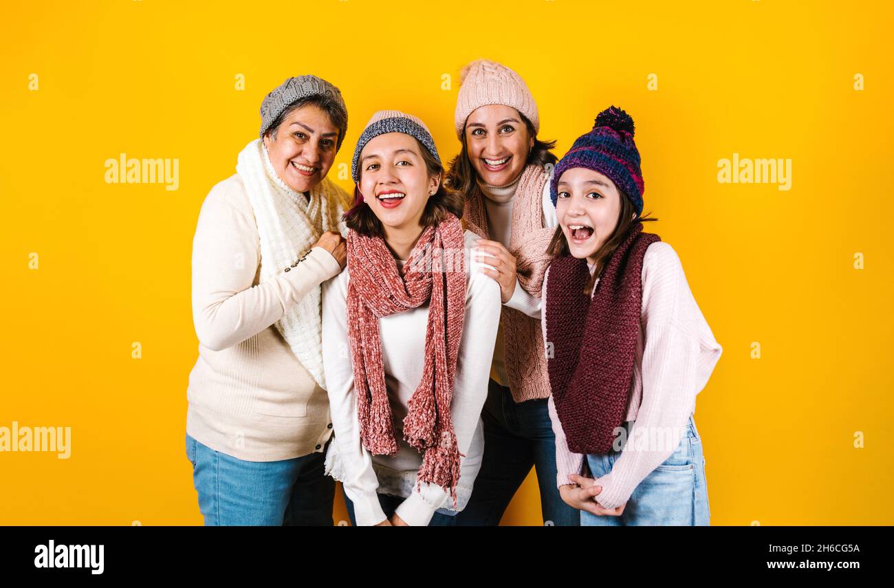 Winter portrait of happy latin family three generations of hispanic ...