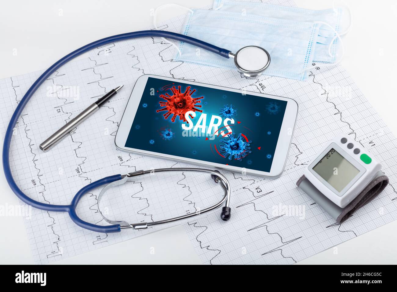 Tablet pc and doctor tools on white surface Stock Photo - Alamy