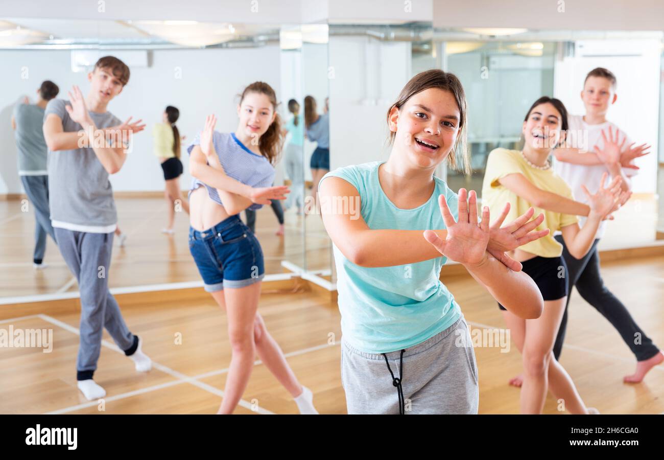 Teenage girl exercising during group dance class Stock Photo - Alamy