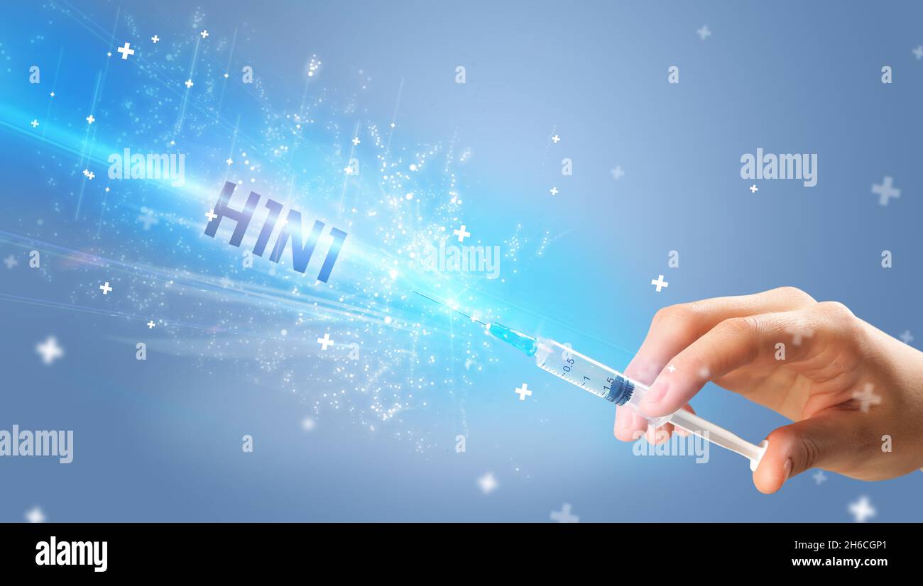 Syringe, medical injection in hand Stock Photo - Alamy