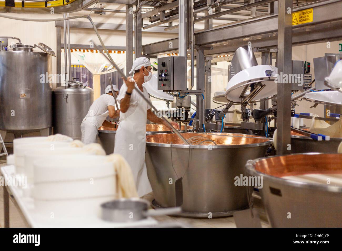 Parmesan Rarmigiano Reggiano italian cheese manufacturing at dairy farm ...