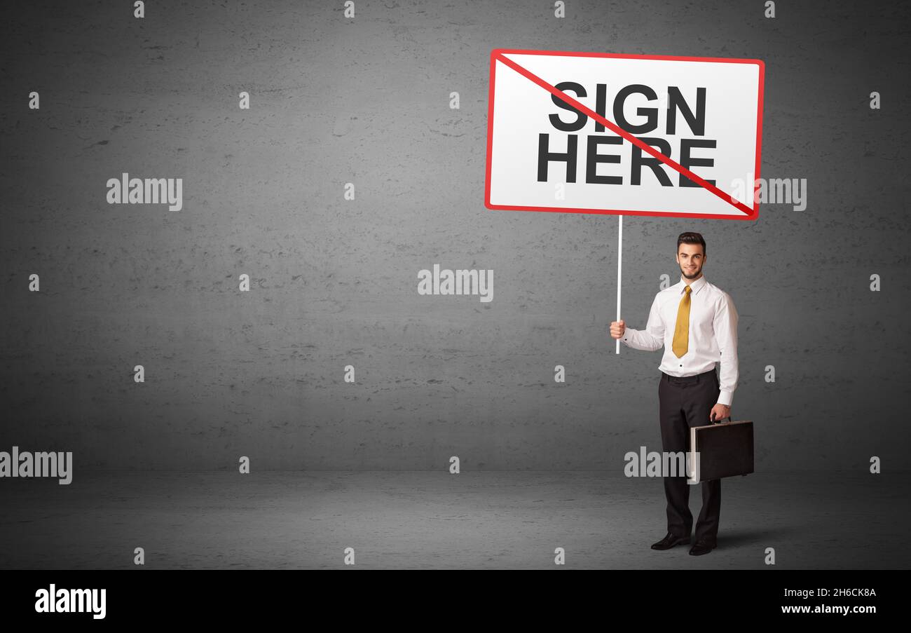 business person holding a traffic sign Stock Photo - Alamy