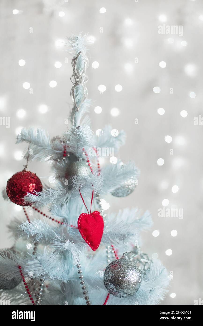White decorated Christmas tree , bokeh background, copy space. Closeup ...