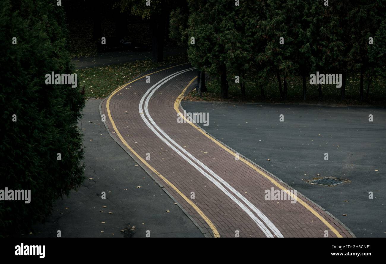 winding bike path through a park with trees. eco environment Stock ...