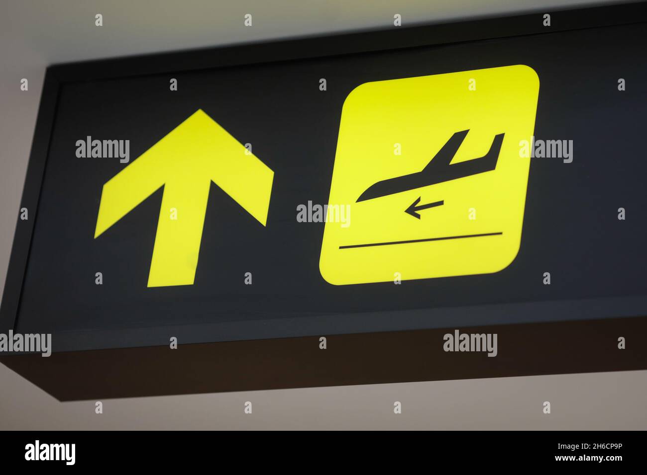 Details with the arrivals sign inside an airport Stock Photo - Alamy