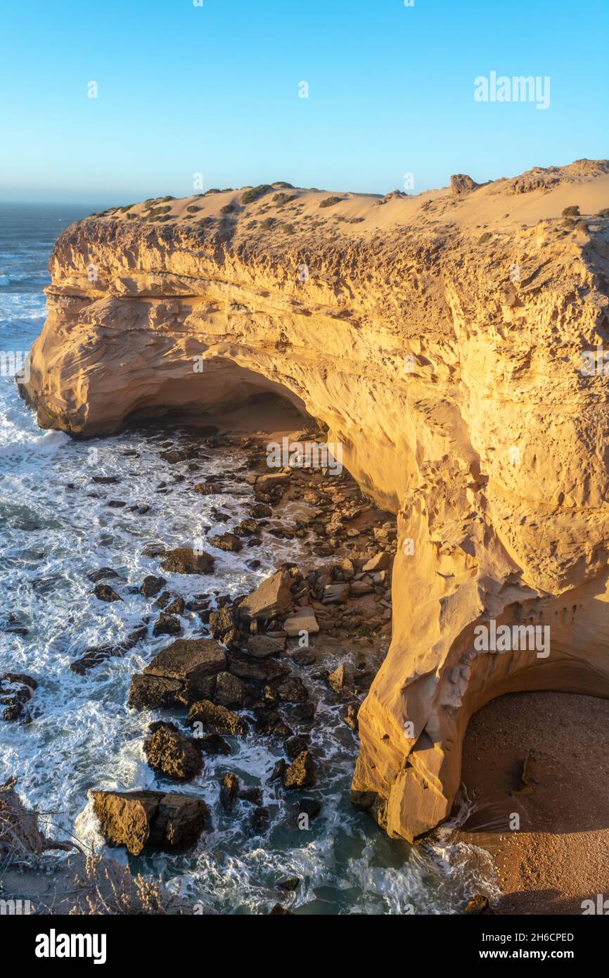 Moroccan Atlantic coast. Wind-sculpted sandy rock cliff Stock Photo - Alamy