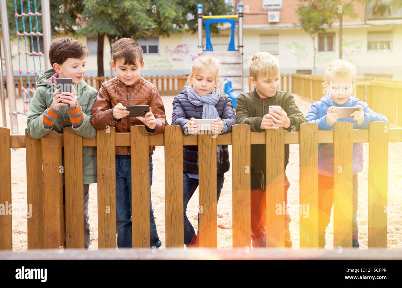 Kids with phone Stock Photo - Alamy
