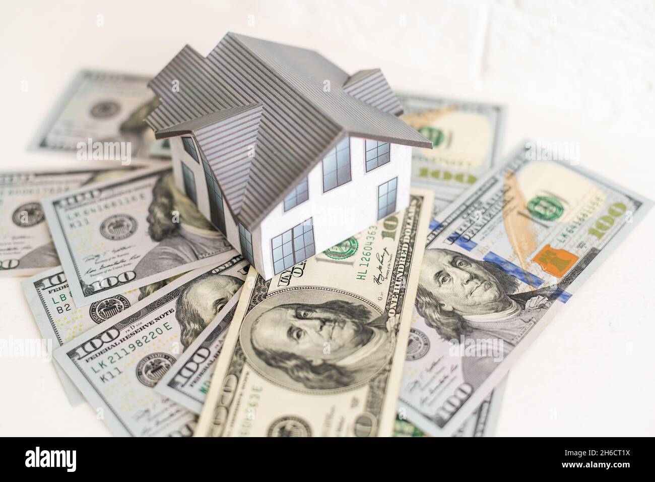 house layout and dollar bills on the background Stock Photo - Alamy