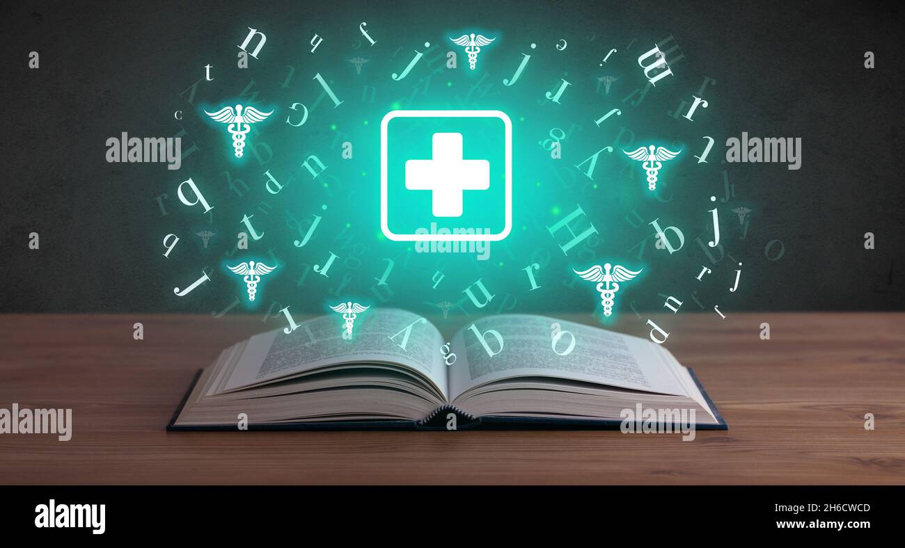 Open medical book with health icons above Stock Photo - Alamy