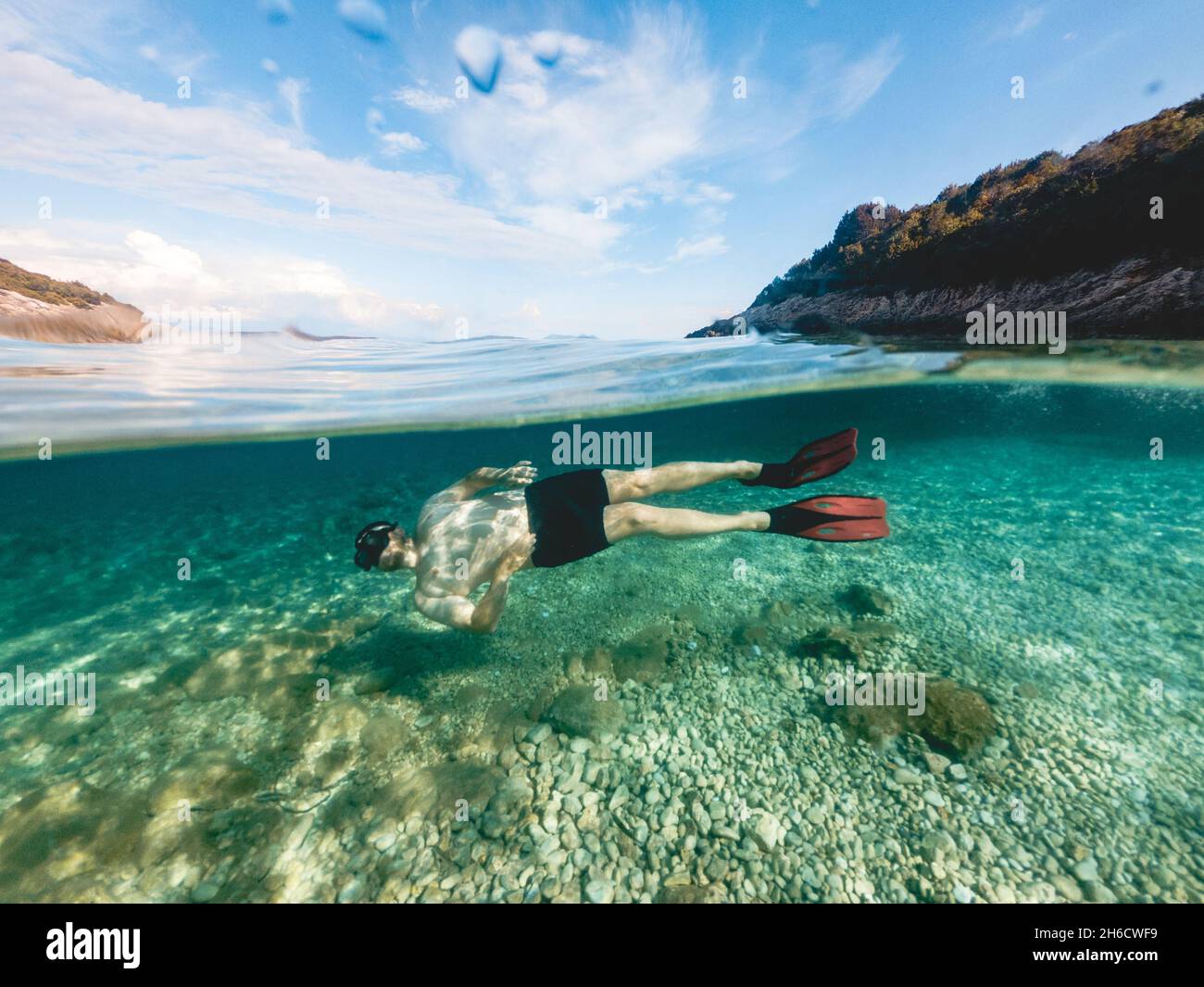 man in diving mask snorkeling in sea water greece vacation Stock Photo ...