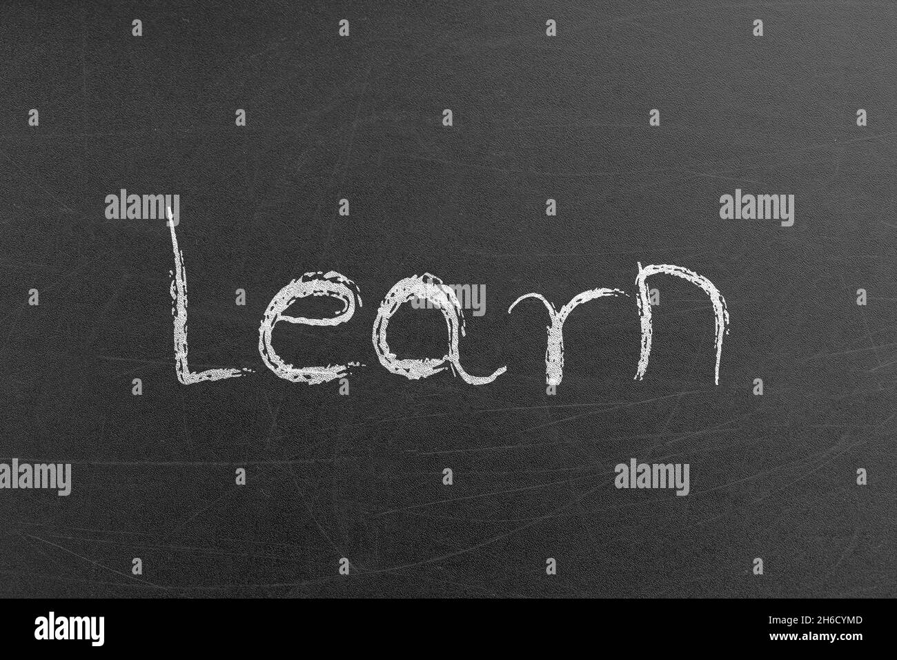 Learn advertisement word drawn by chalk on a school blackboard before ...