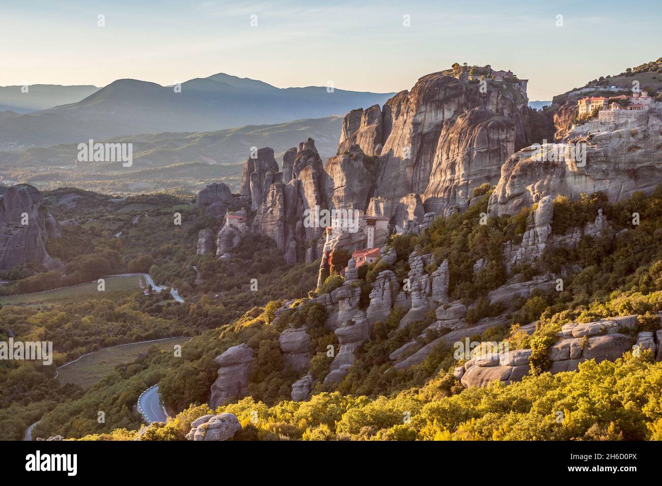 The Meteora at sunset. Meteora is a formation of immense monolithic ...