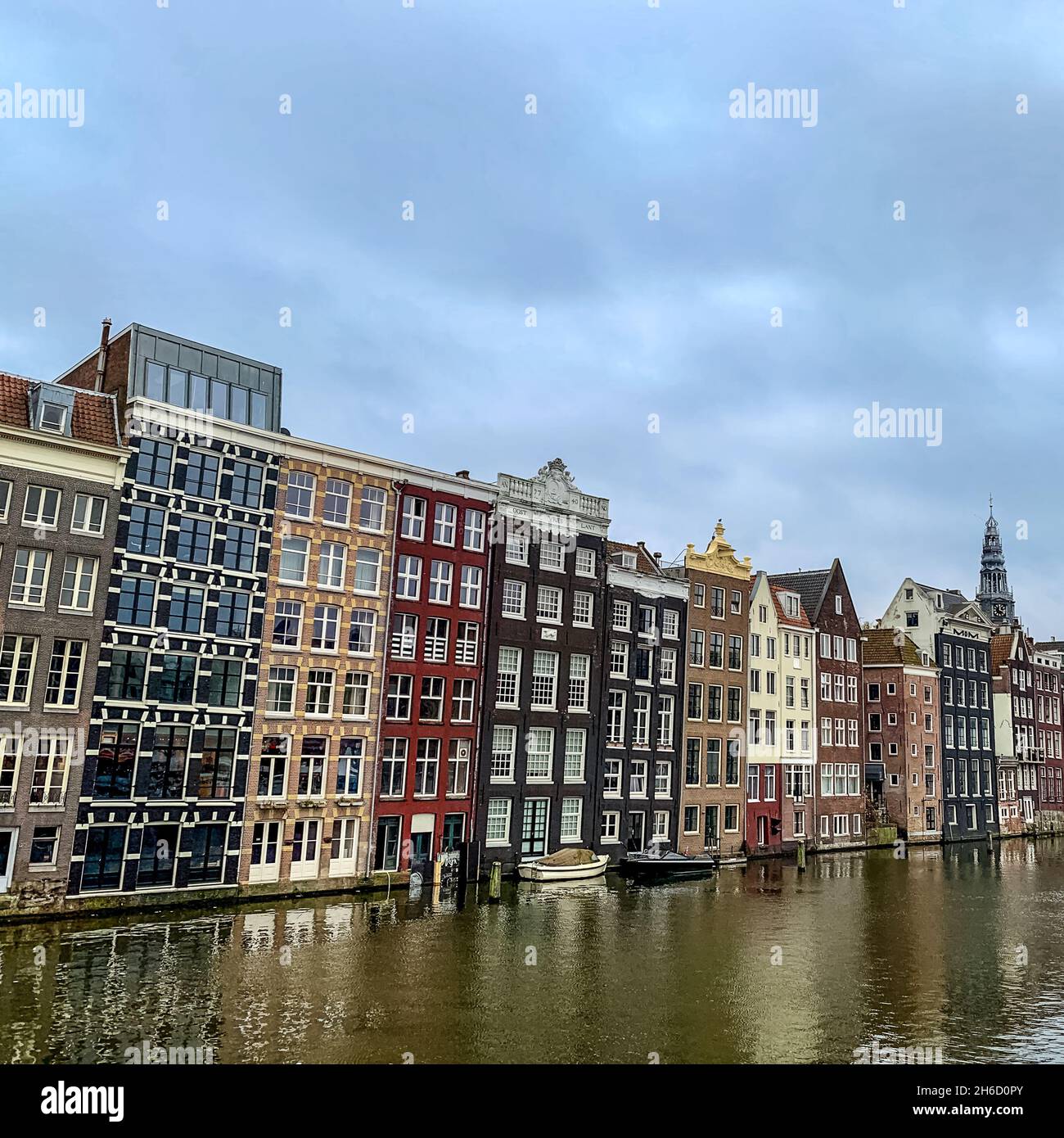 Amsterdam houses reflected in the canal with blue sky background Stock ...