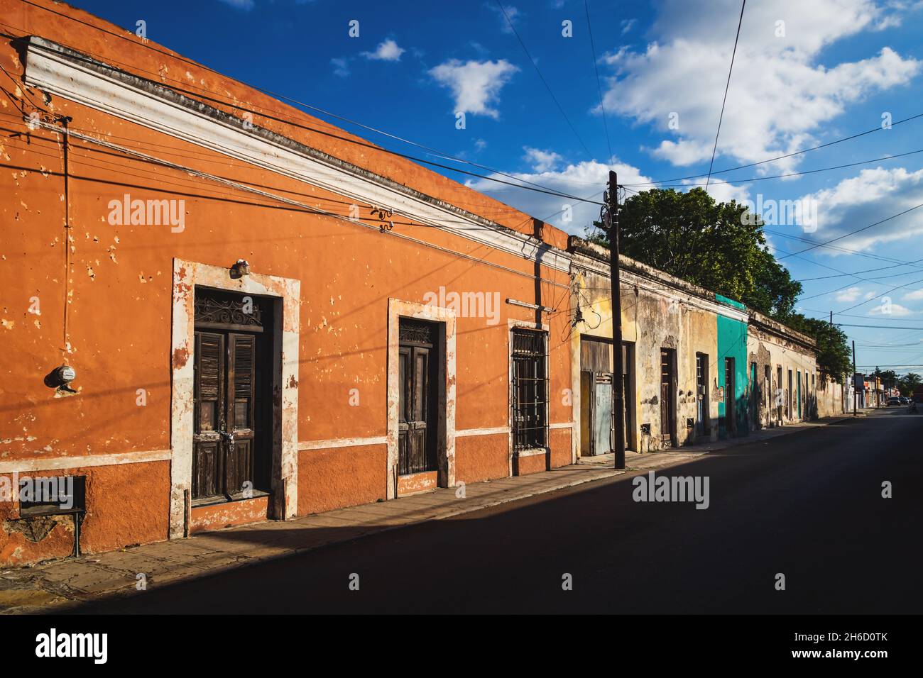 Street with typical Mexican old colorful colonial house facades in ...