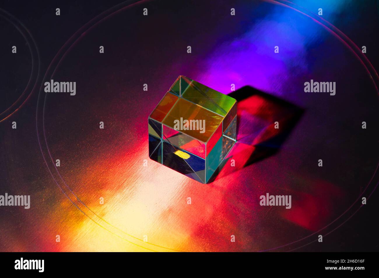 Glass cube prism on a colorful bright surface Stock Photo - Alamy