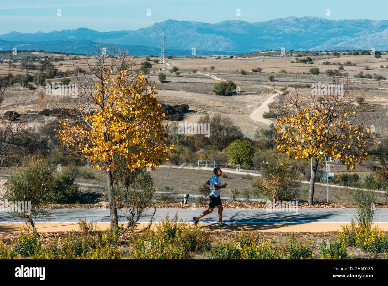 Runner facing west towards El Pardo mountains. Part of Madrid's Anillo ...