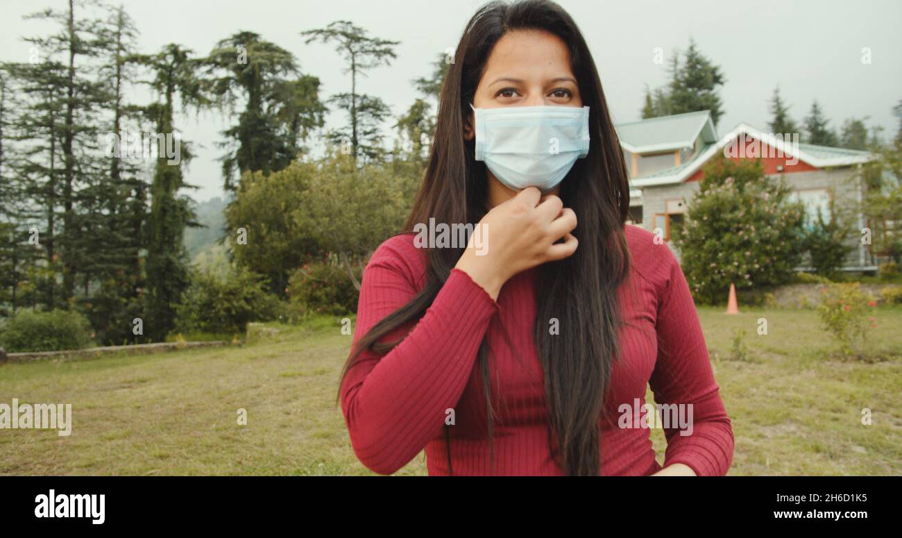 Young Indian female wearing a face mask outdoors Stock Photo - Alamy