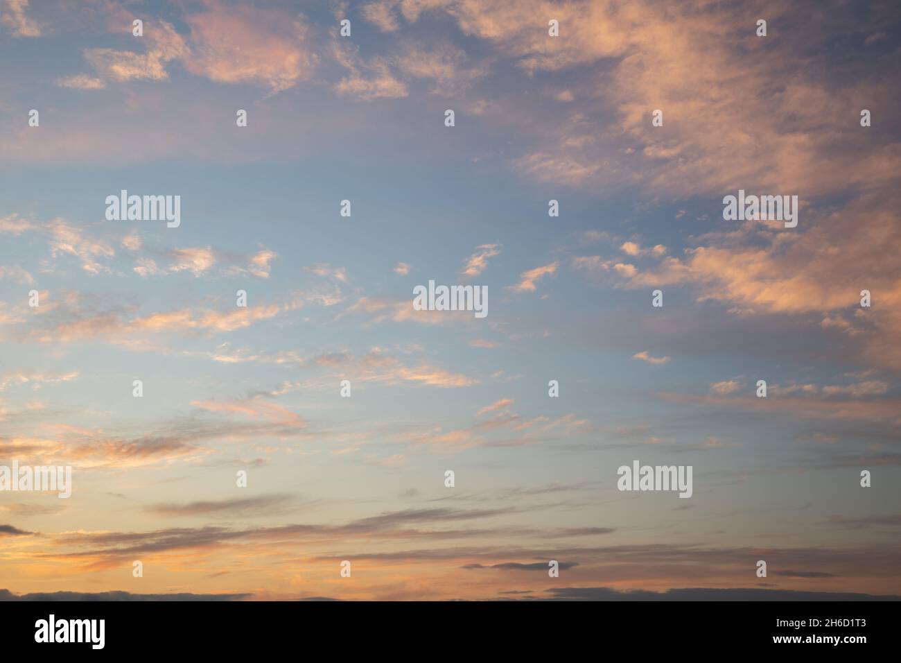 Beautiful dramatic sunset sky with pink clouds lit by the setting sun ...
