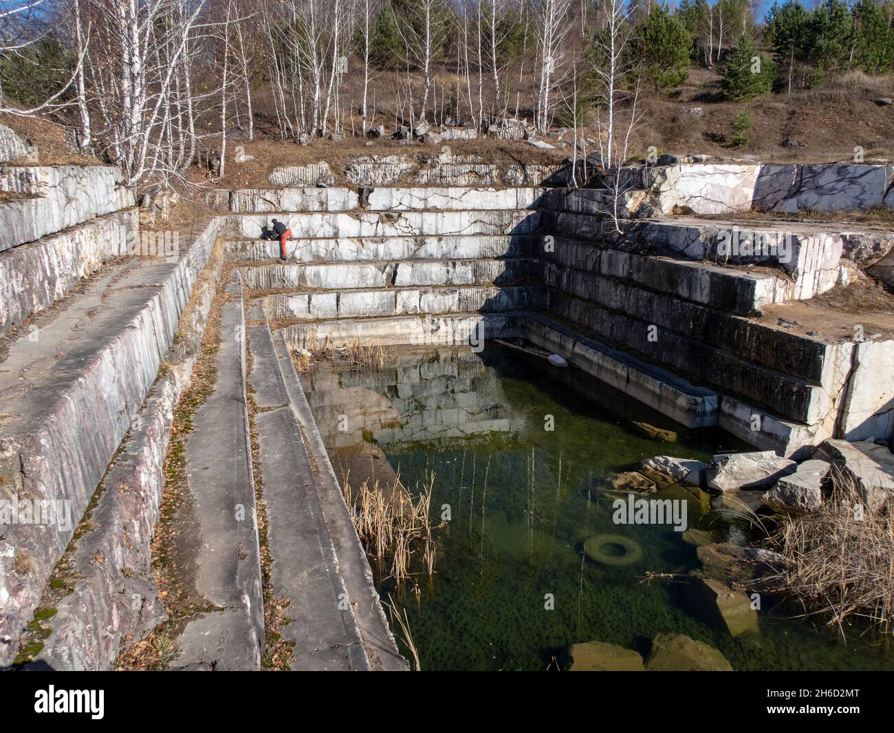 Autumn view of an abandoned quarry for the production of marble and ...