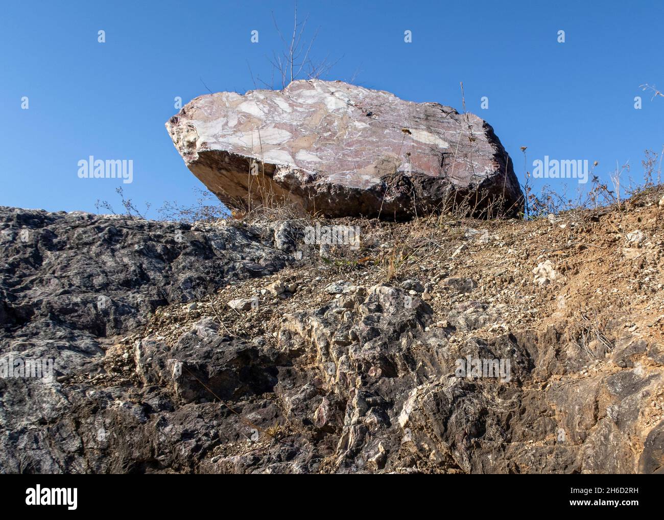 A huge piece of marble rock with an even cut pulled out of a mine on ...