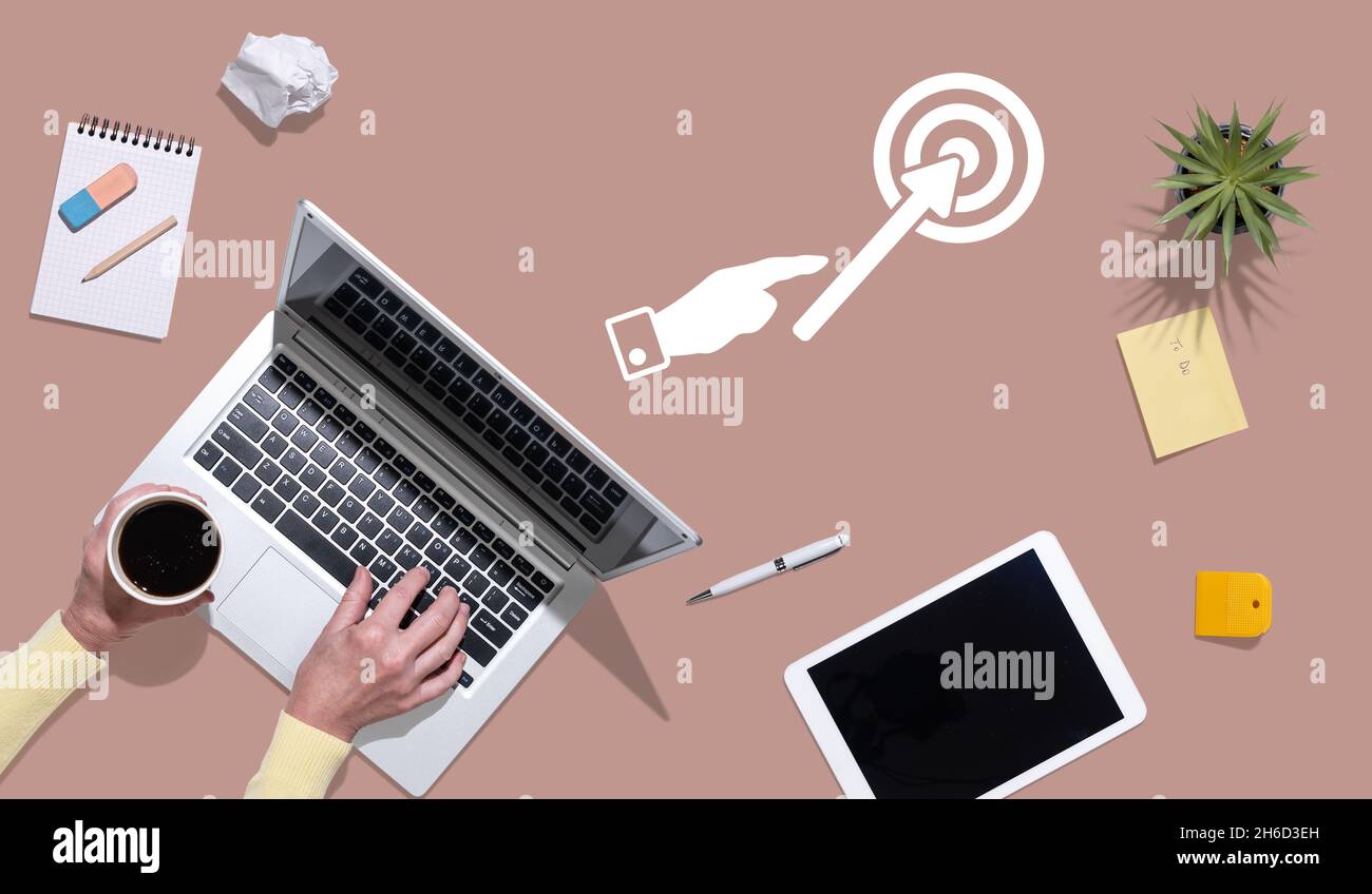 Top view of hands using laptop with symbol of motivation concept Stock ...