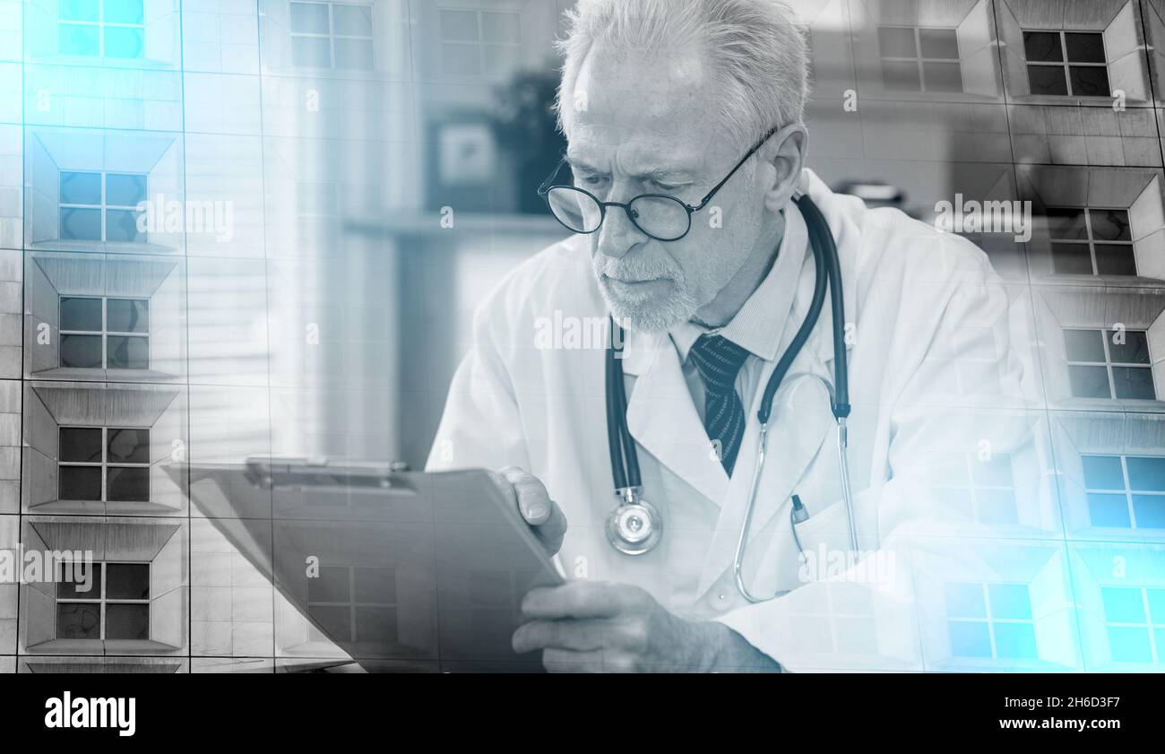 Senior doctor reading a clinical record in medical office; multiple ...