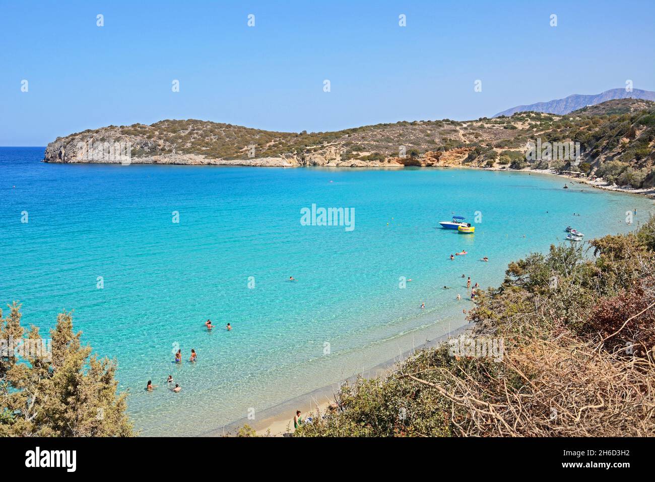 Elevated view of the beach and coastline with mountains to the rear ...