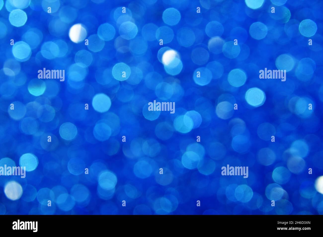 Abstract background of cold winter blue bokeh defocused blurred lights ...