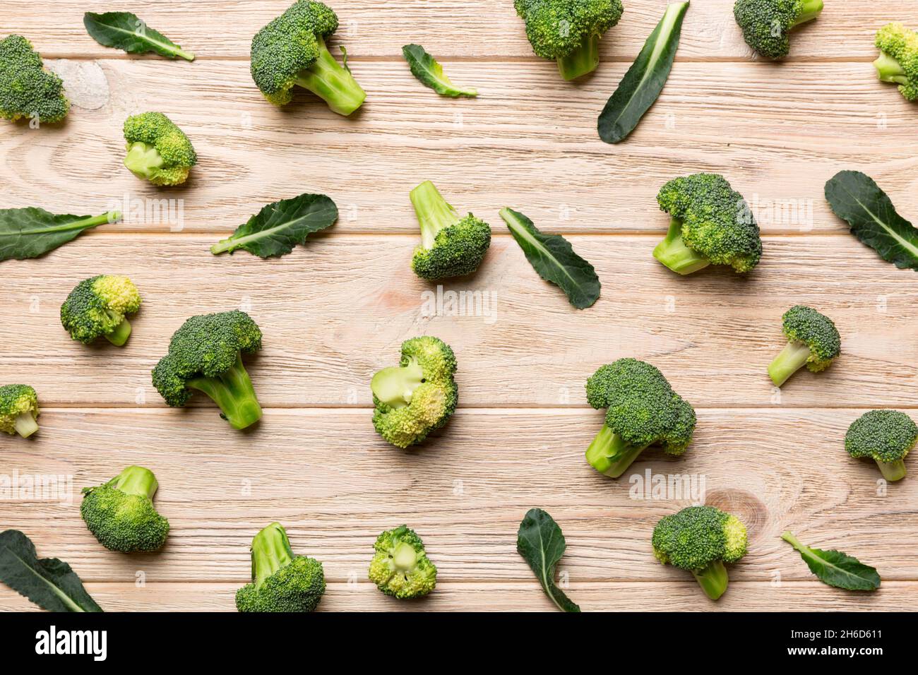 green fresh broccoli background close up on colored table. Vegetables ...