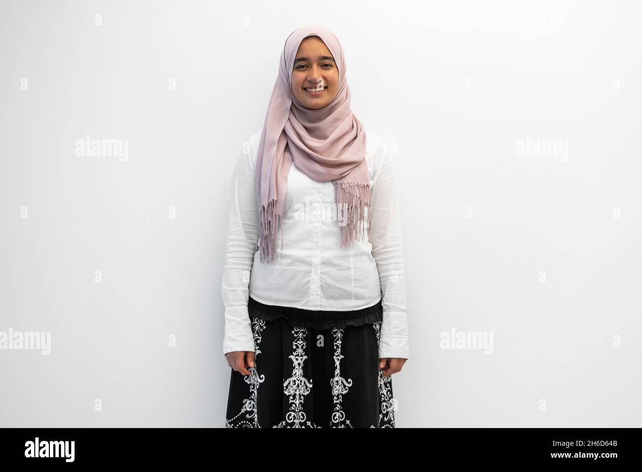 Arab female Muslim in traditional hijab clothes for praying namaz ...