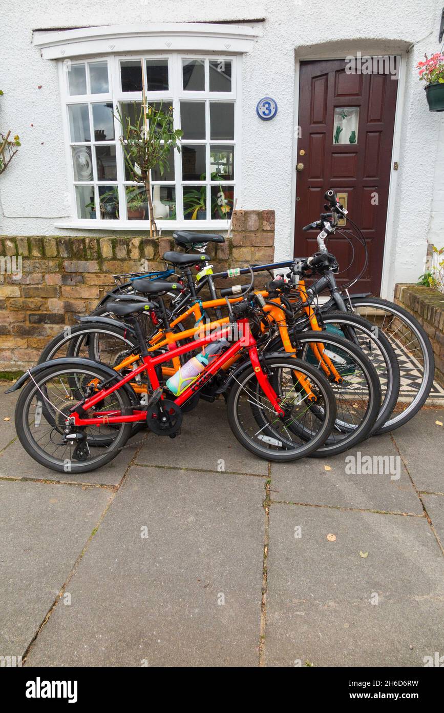Four bicycles / bikes / 4 cycles locked sales outside the home of a ...