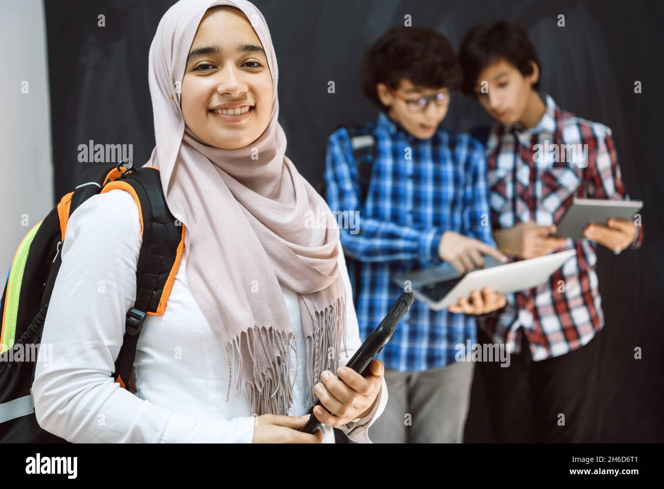 Arabic teenagers team, students group working together on laptop and ...