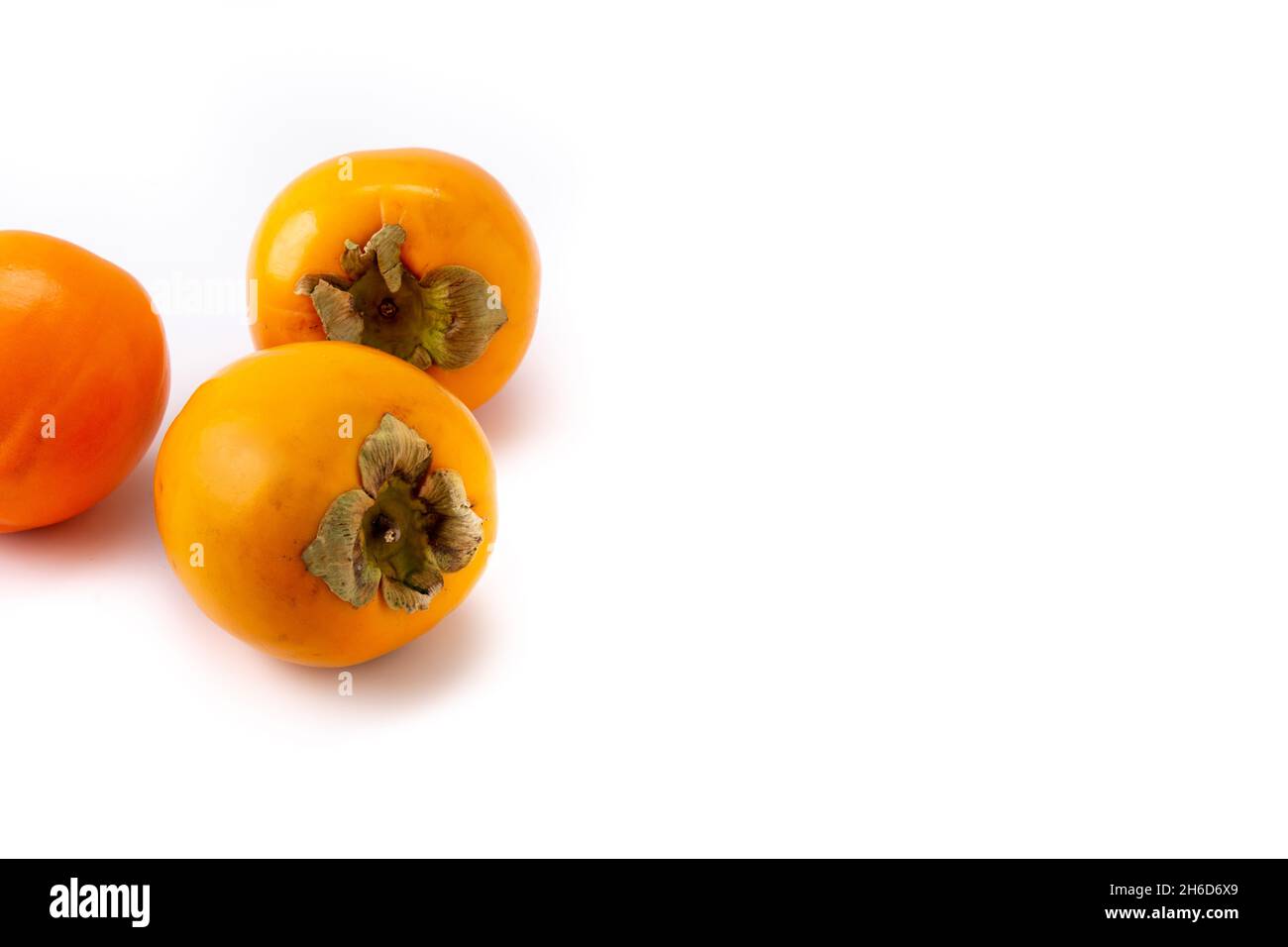 Fresh persimmon fruit isolated on white background Stock Photo - Alamy