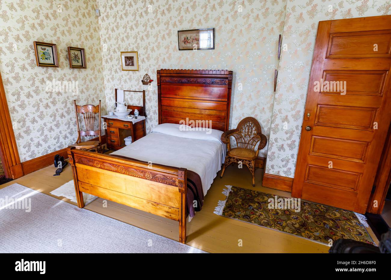 Traditional 19th century bedroom and carved wooden double bed in the ...