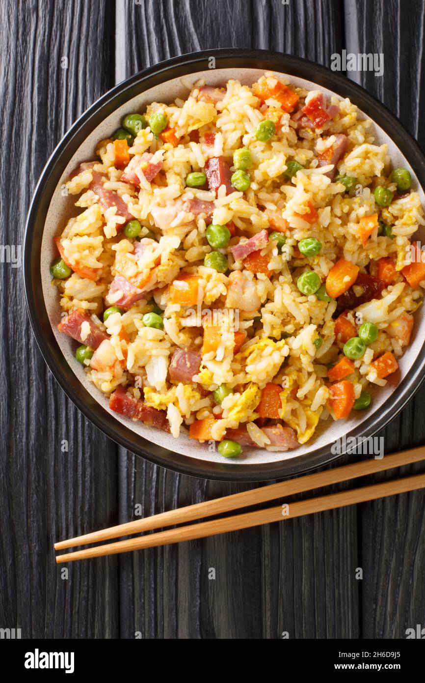 Yangzhou fried rice Traditional Chinese food close up in the plate on ...