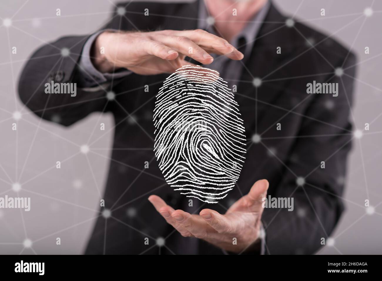 Fingerprint security system concept between hands of a man in ...