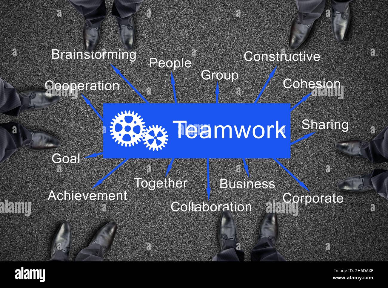 Feet around teamwork concept drawn on a road Stock Photo - Alamy