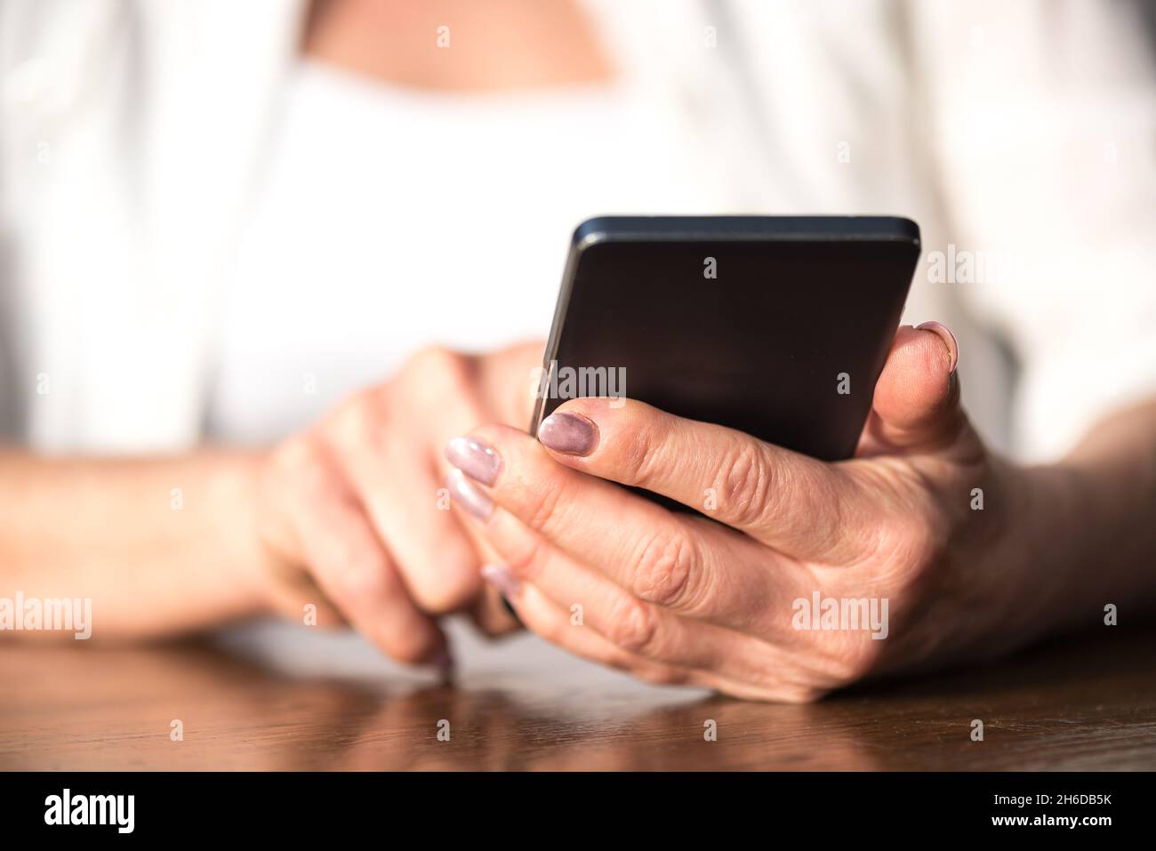 Close up of woman's hands using a mobile phone Stock Photo - Alamy