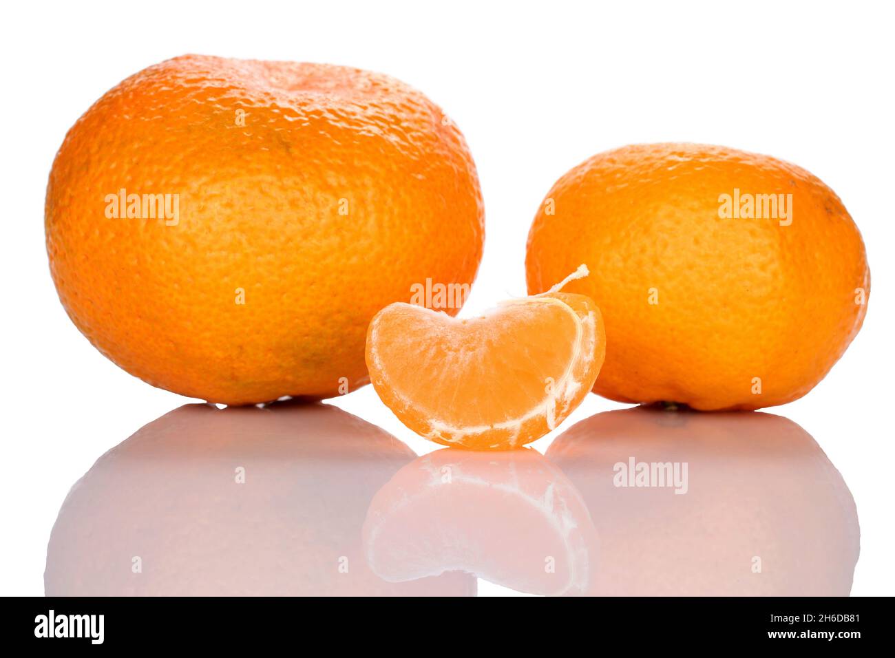 n the foreground, in focus, one whole slice of peeled bright yellow ...