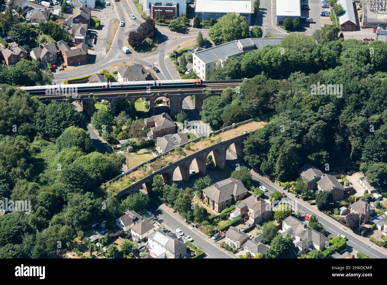 A train crossing a viaduct on the Poole and Bournemouth Railway with a ...