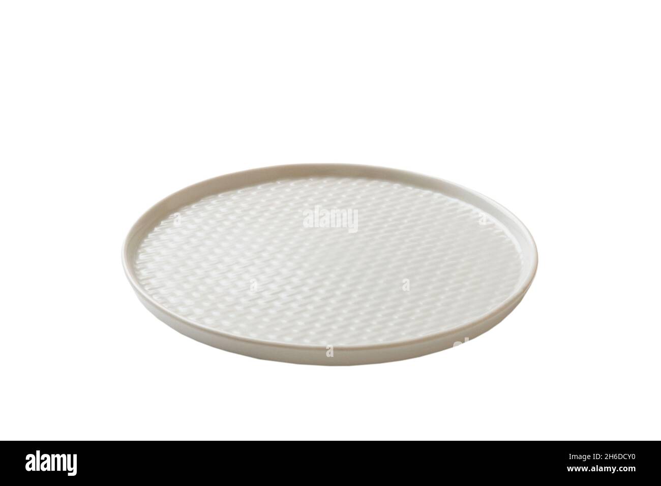 White ceramic round plate isolated over white background. perspective ...