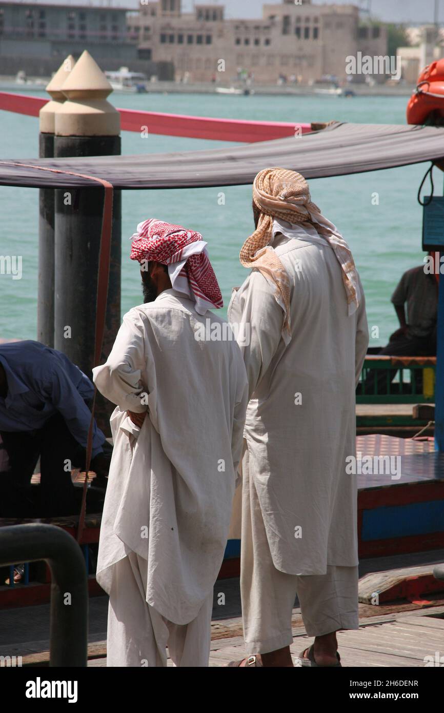 two Arab men in traditional dress with kufiya and kandura, United Arab ...