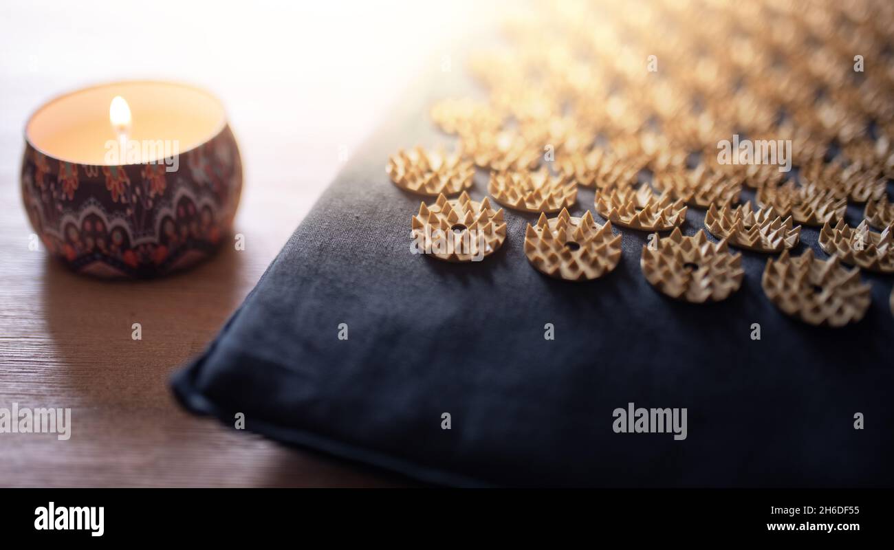 Acupuncture mate with a candle. Traditional Chinese medicine Stock ...