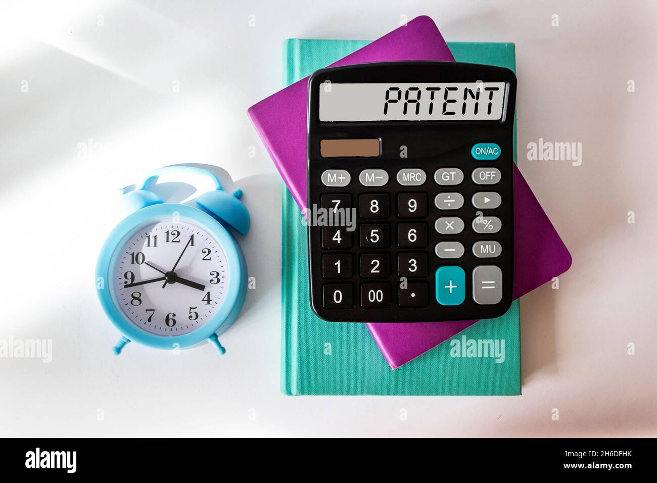 Calculator with patent text on display. On a white background ...